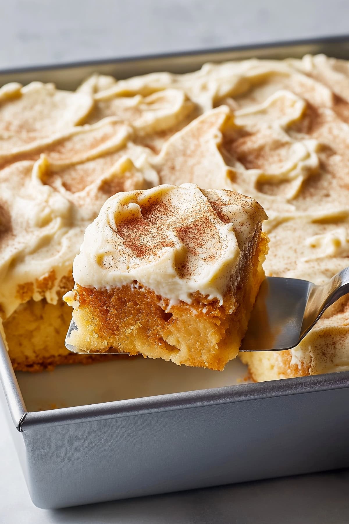 Cinnamon Roll Poke Cake - Insanely Good